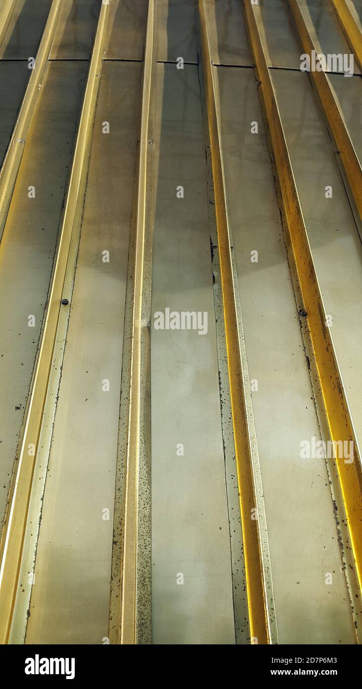 Golden metal. Golden panel. Wall of steel panels golden color Stock ...