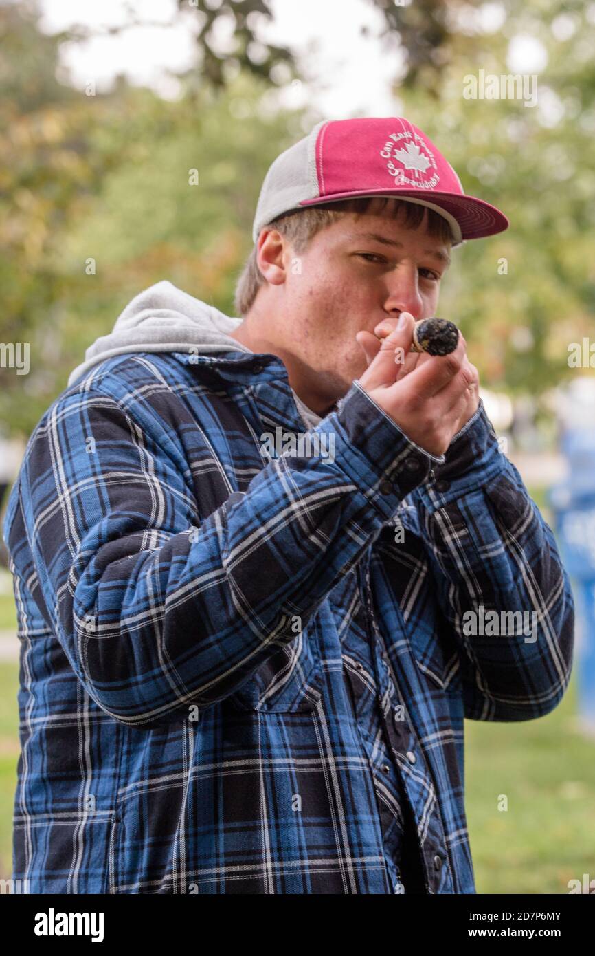 A man smoking a massive joint during the cannabis legalization ...