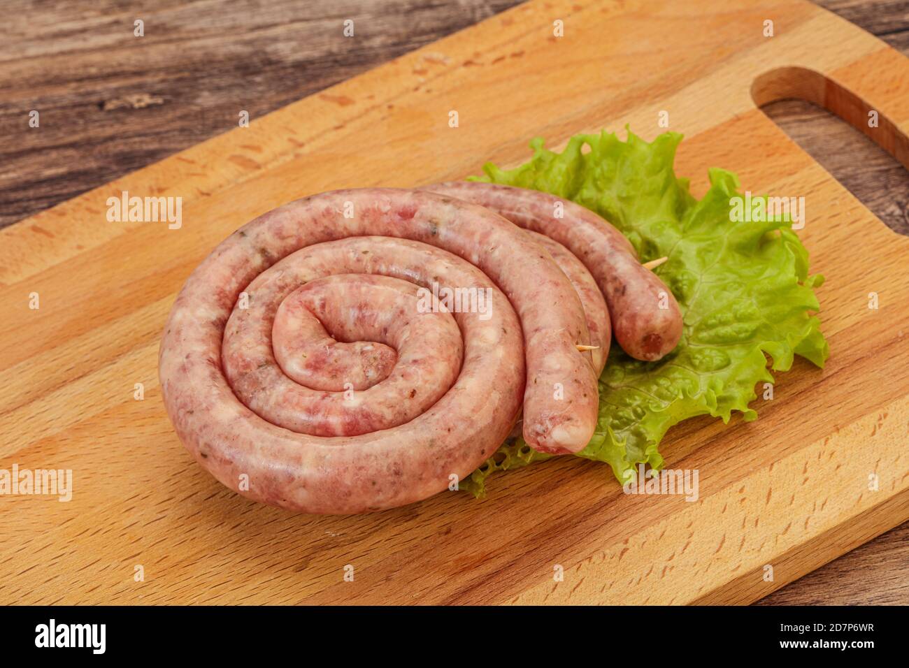 Raw pork sausage ring for grill Stock Photo - Alamy