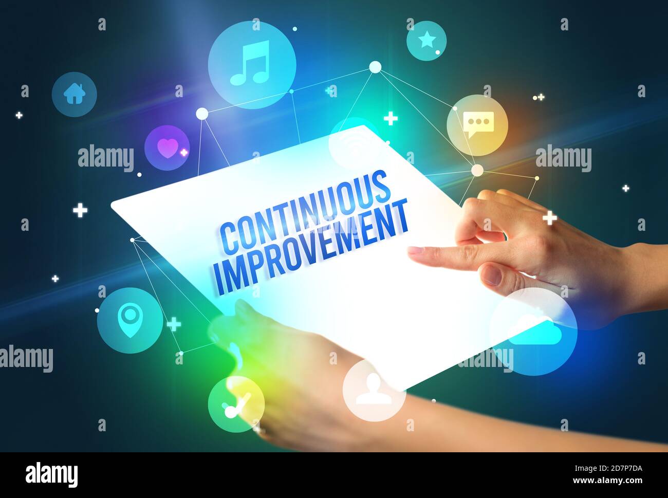 Holding futuristic tablet with CONTINUOUS IMPROVEMENT inscription, new ...