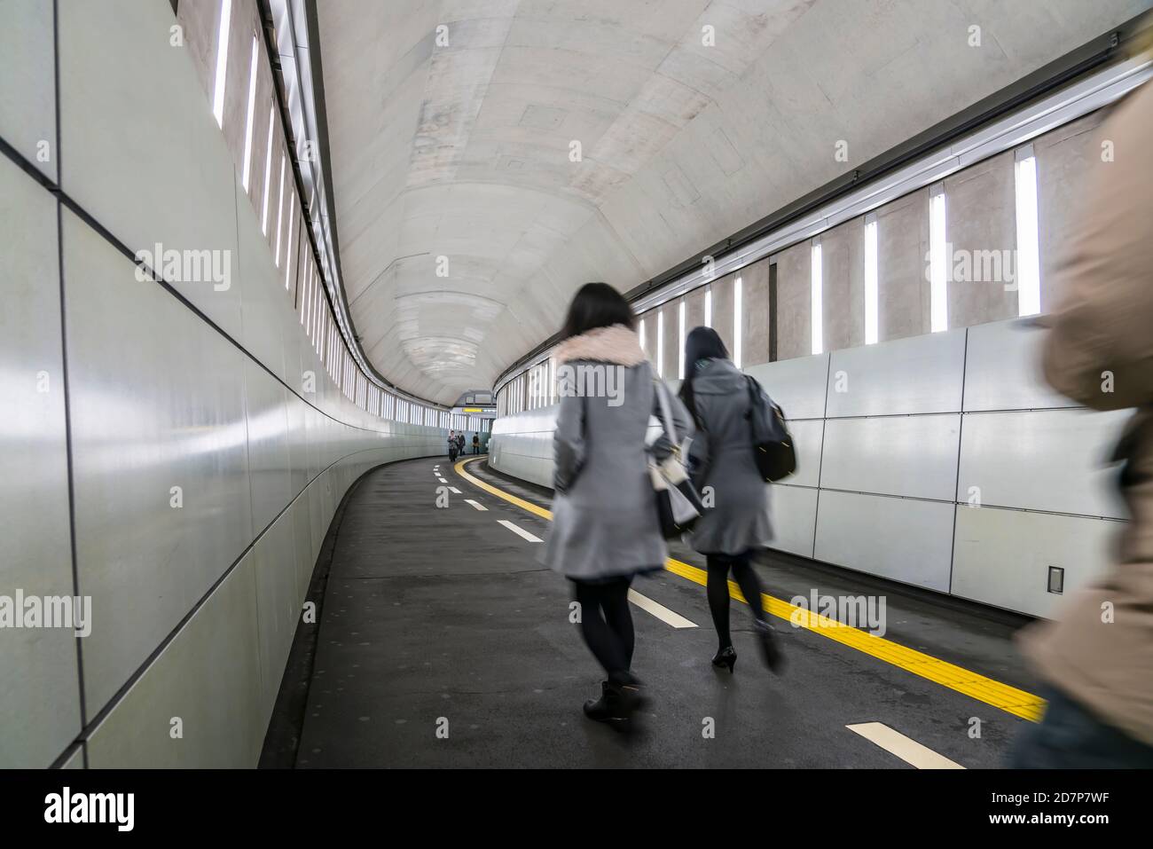 Commuters walk on the passageway at Toei Oedo Line Iidabashi Tokyo ...