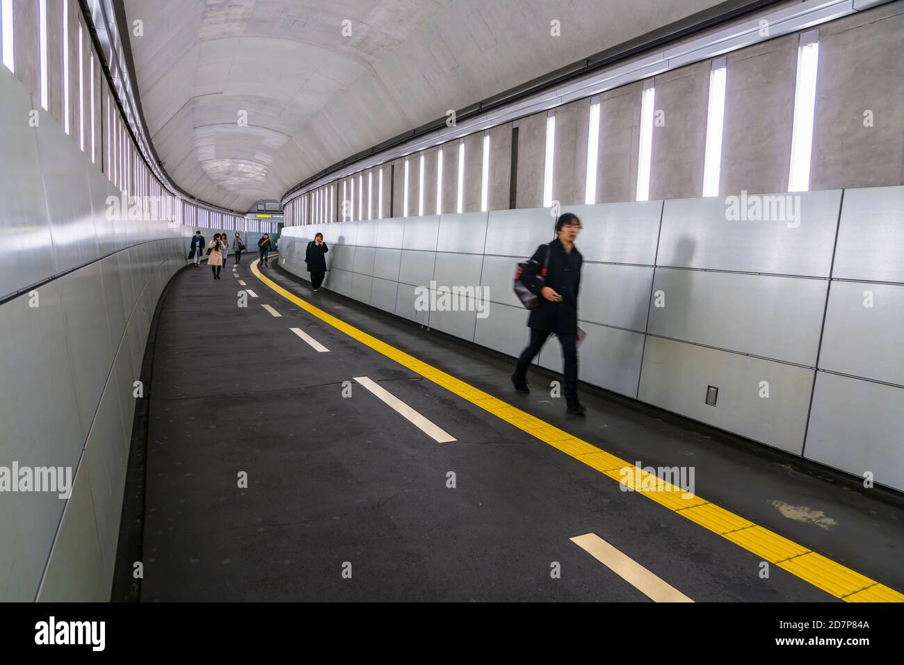 Commuters walk on the passageway at Toei Oedo Line Iidabashi Tokyo ...