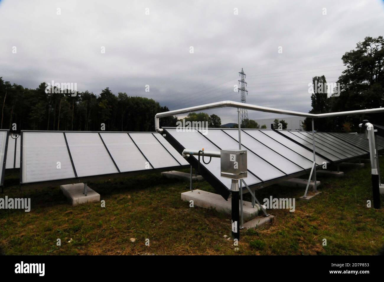 solar energy collector field and a pylon in the background Stock Photo ...