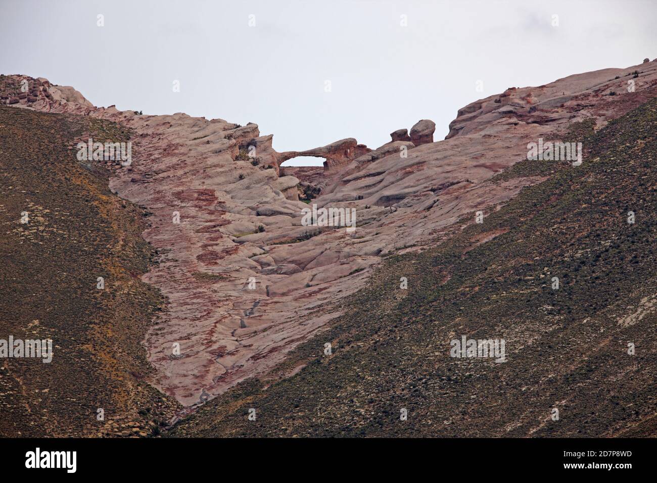 a natural bridge formation on eroded hillside near Abra Pampas, Jujuy ...