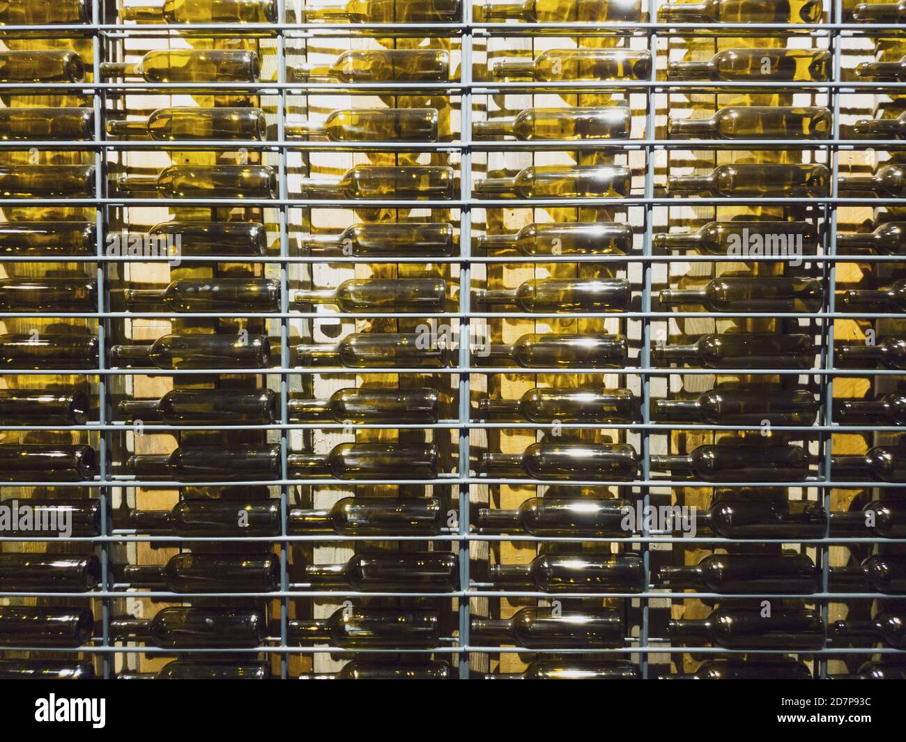 A wine rack, a wall decorated with empty wine bottles Stock Photo - Alamy
