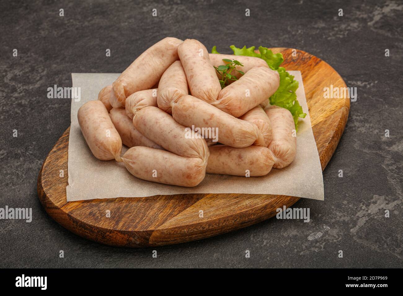 Raw natural chicken baby sausages for roast Stock Photo - Alamy