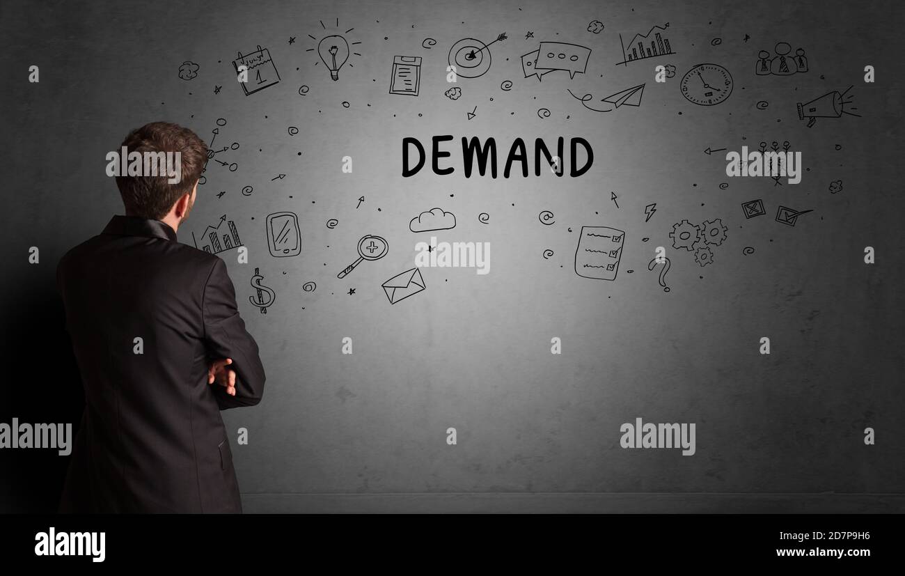 businessman drawing a creative idea sketch with DEMAND inscription ...