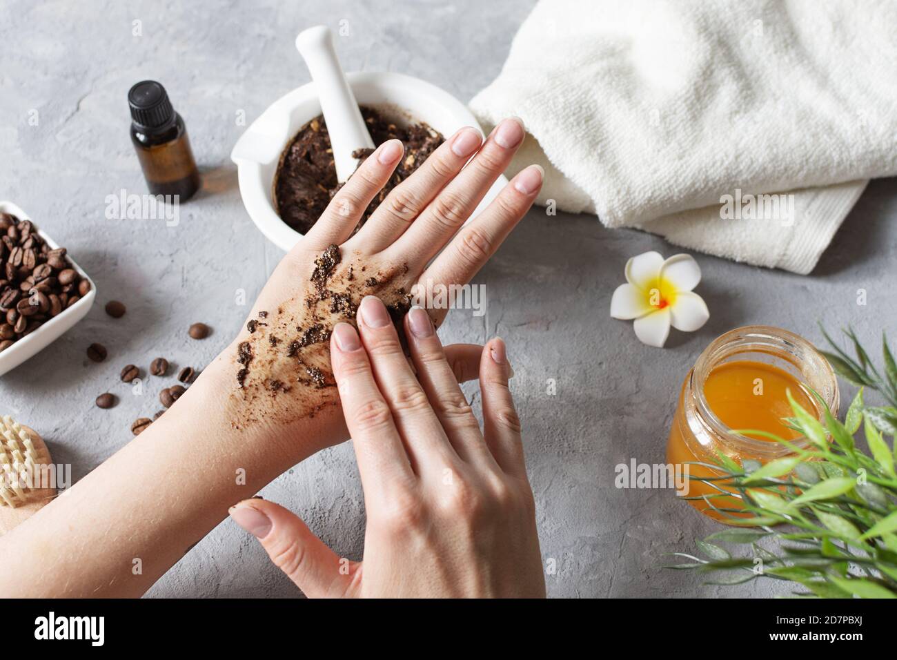 Woman hands making peeling with homemade body scrub made with ground ...