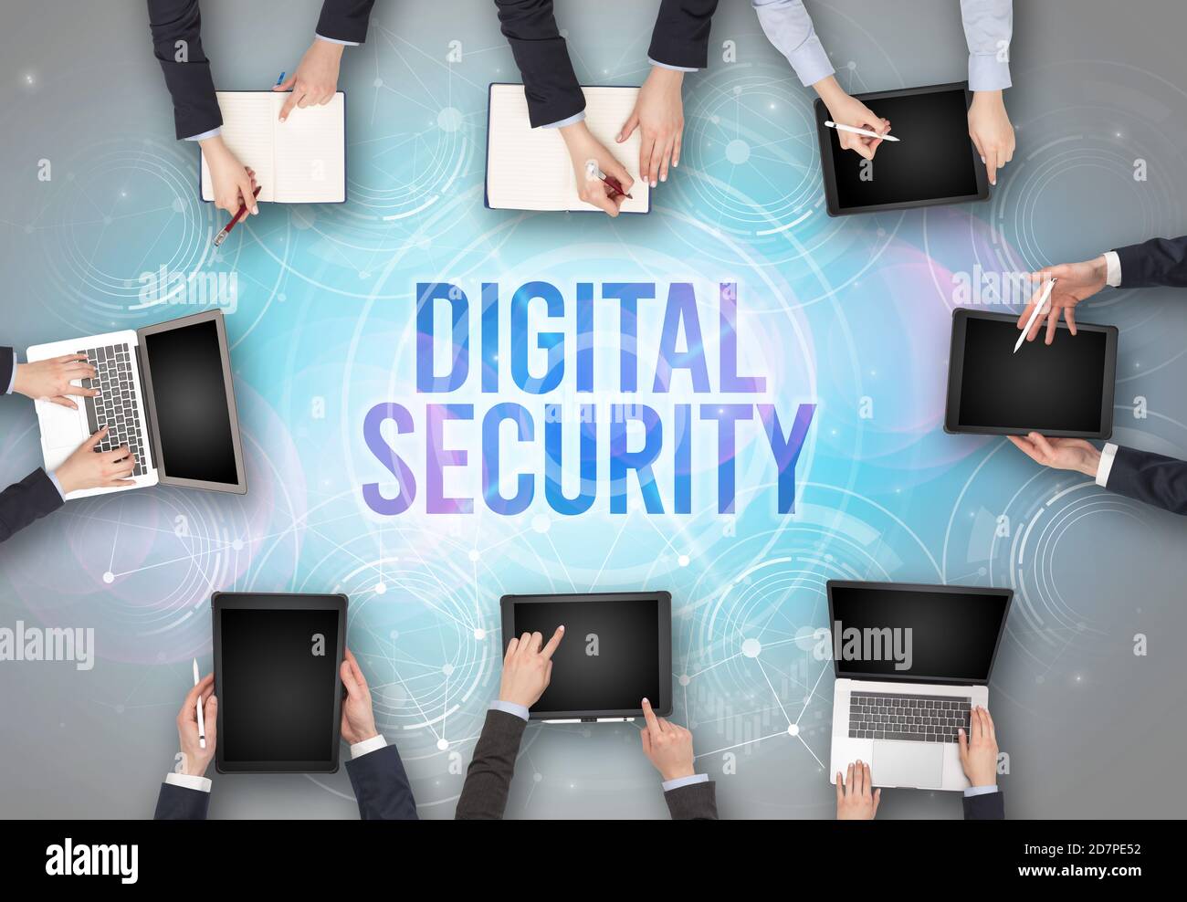 Group of people in front of a laptop with DIGITAL SECURITY insciption ...