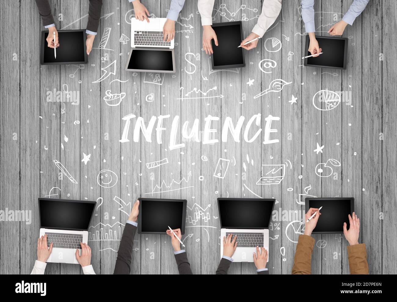 Group of business people working in office with INFLUENCE inscription ...