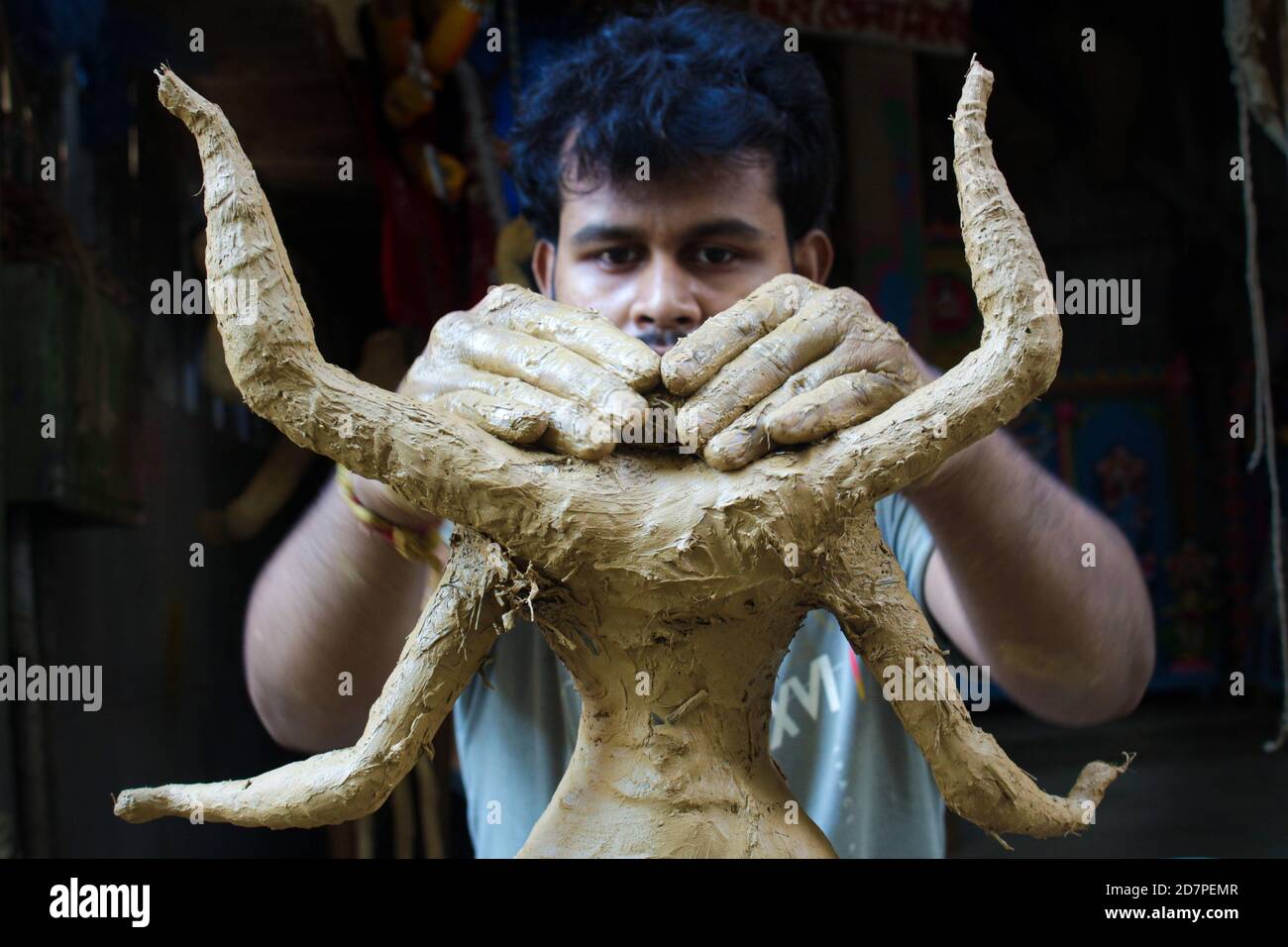 An Idol artist is busy shaping and curving of a Goddess Kali Idols in ...