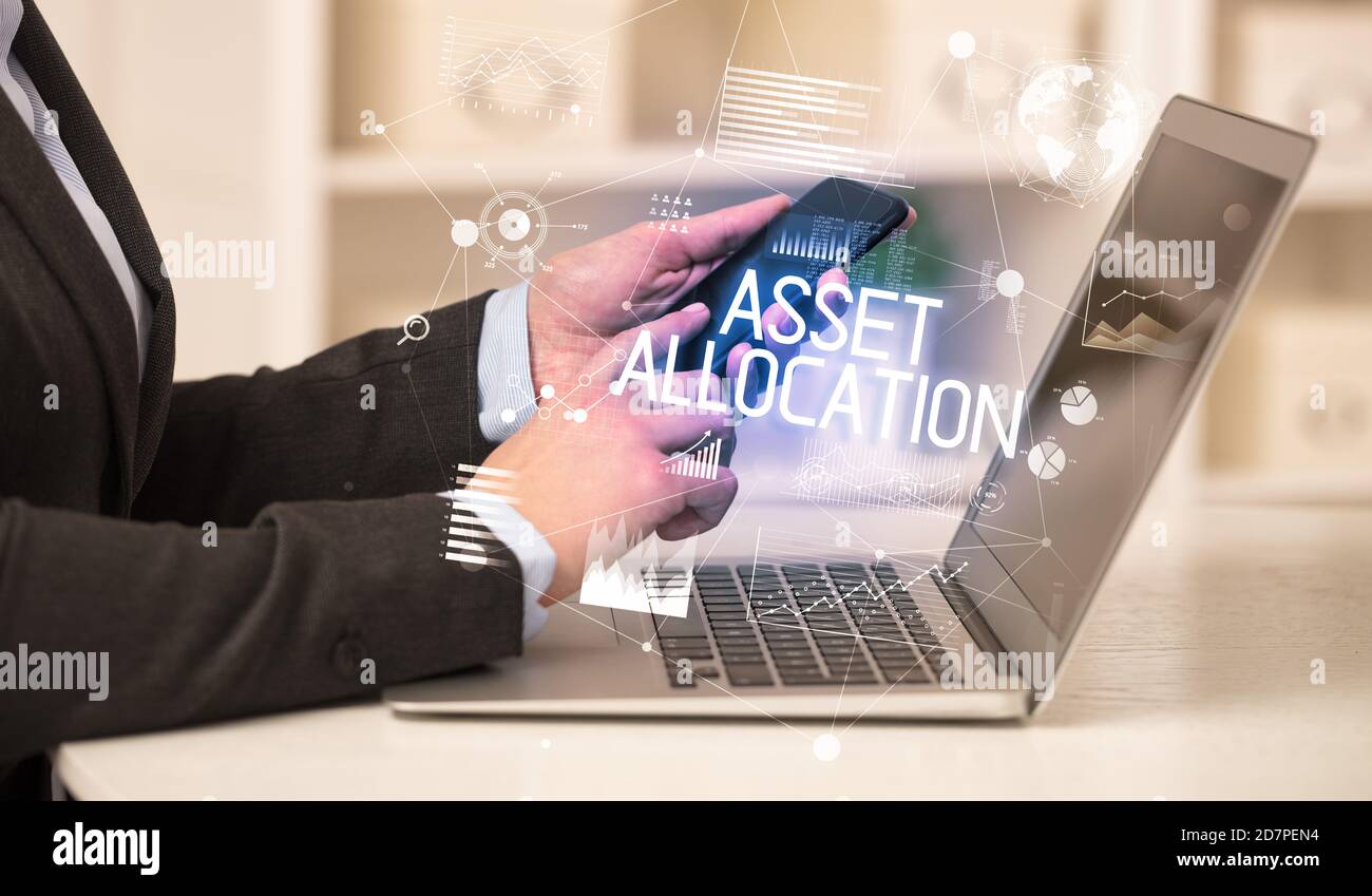 Side view of a business person working on laptop with ASSET ALLOCATION ...