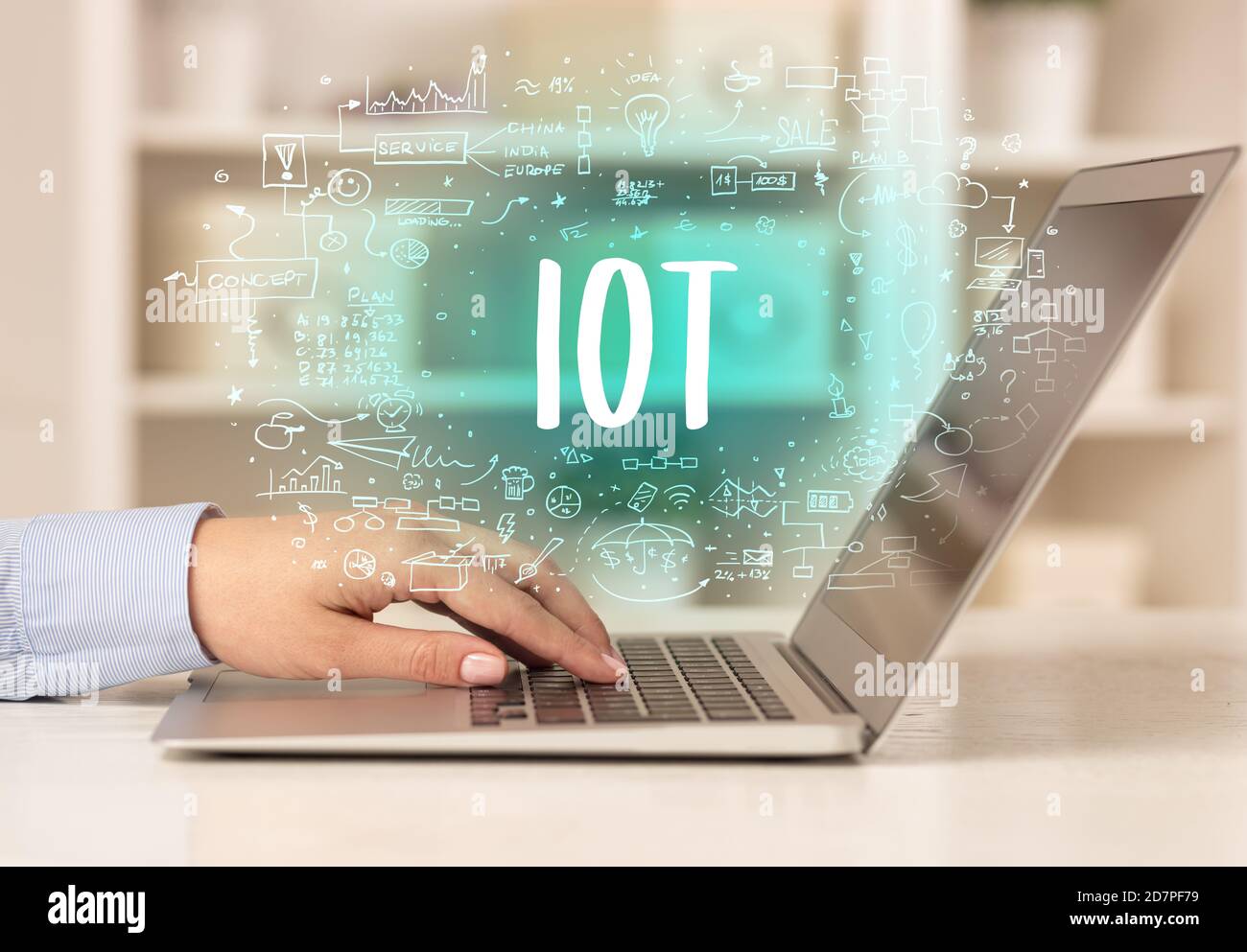 hand working on new modern computer with IOT abbreviation, modern ...