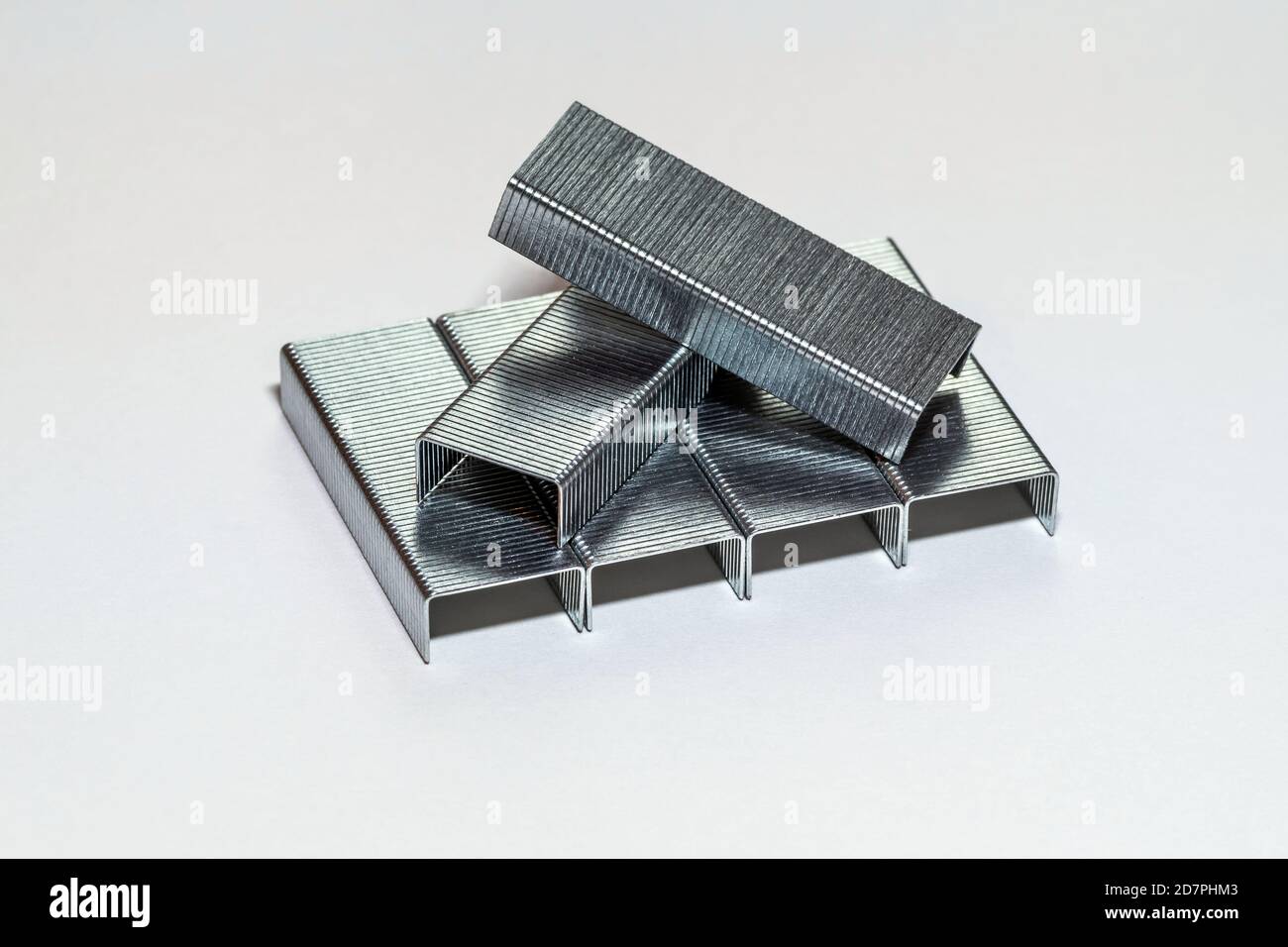 Metal staples isolated on a white background Stock Photo - Alamy