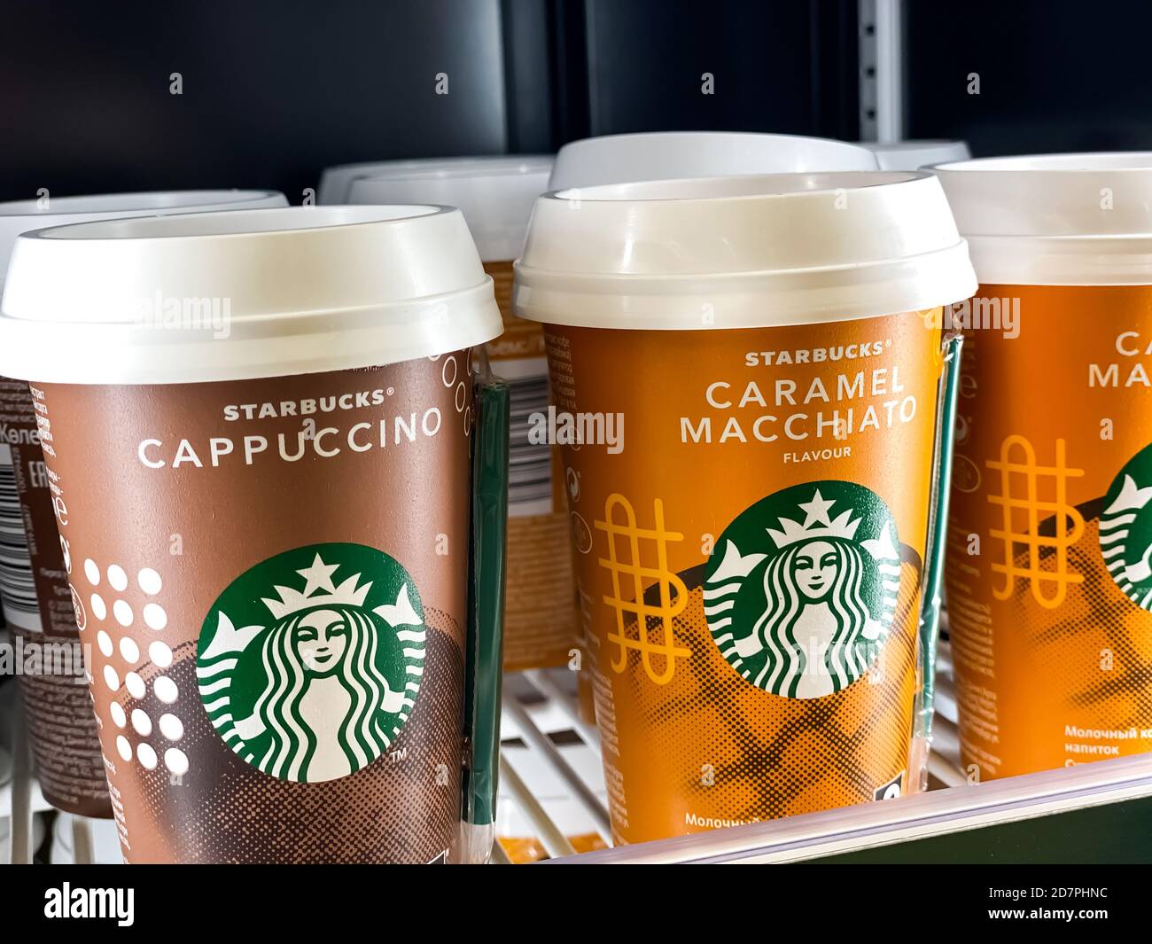 Starbucks coffee cups row ready to go in a supermarket fridge shelf ...