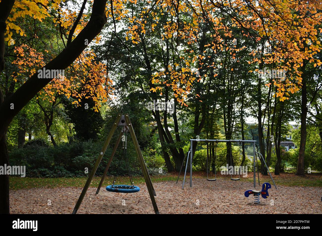 children kinder playground in autumn fall spring with a tree with ...