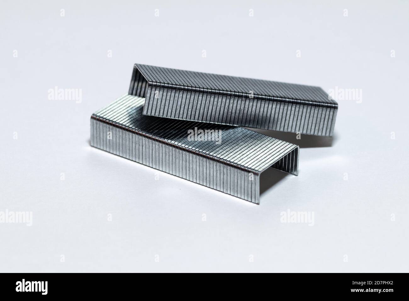 Metal staples isolated on a white background Stock Photo - Alamy