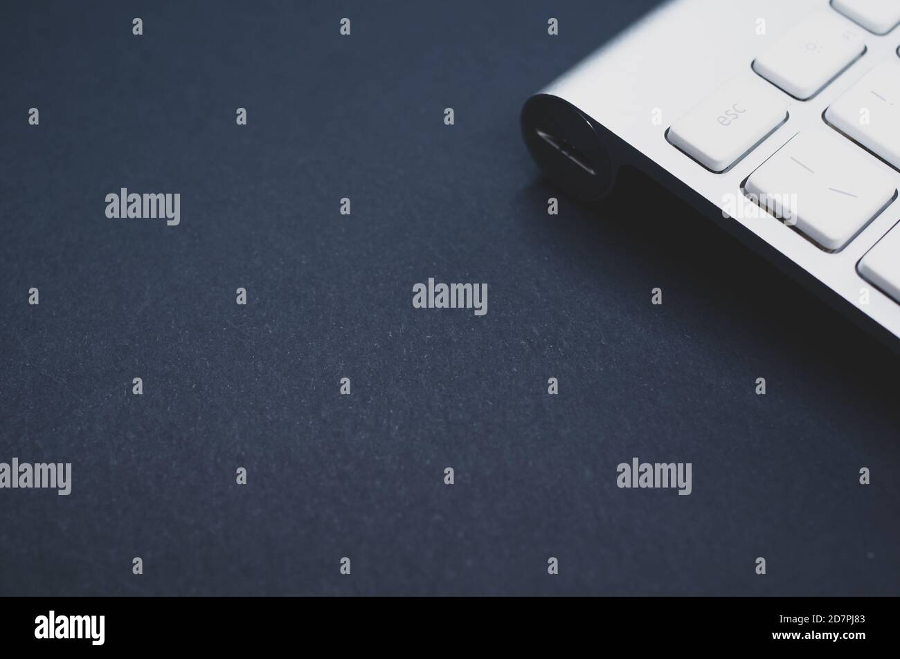 Closeup of a modern and clean keyboard on a dark surface Stock Photo ...