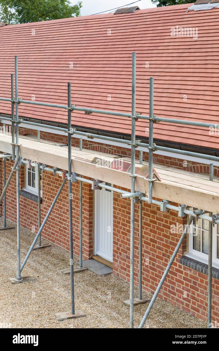 Scaffolding outside a new build house, barn conversion, UK Stock Photo ...
