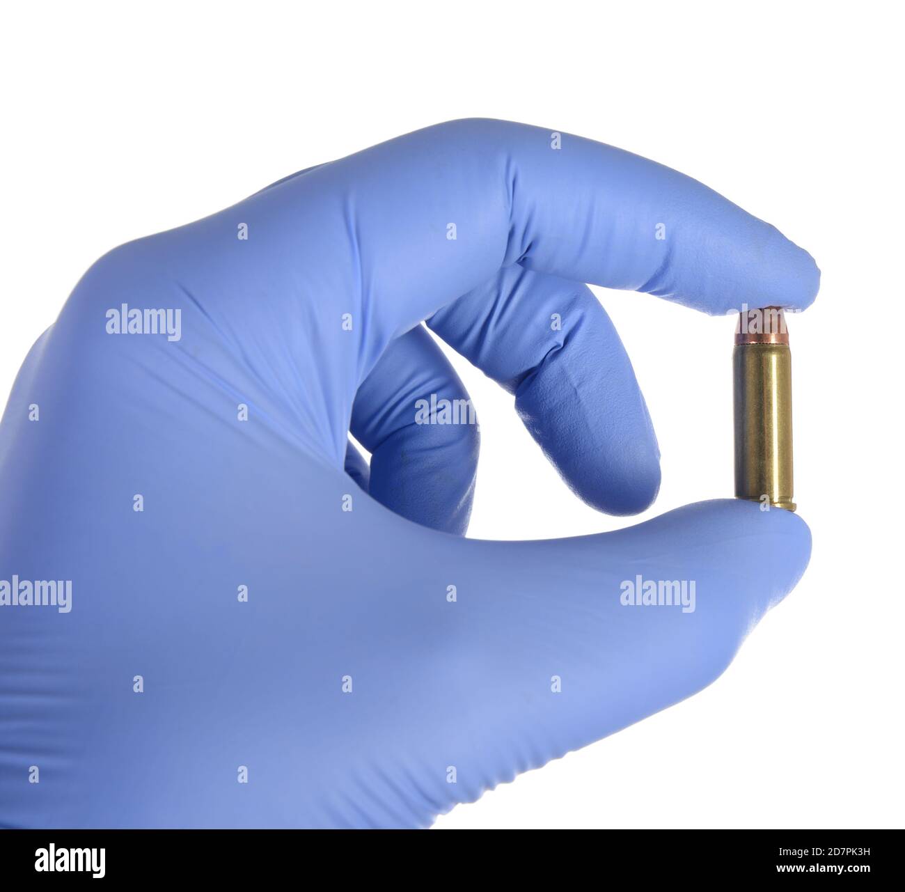 Bullet in fingers on white background. Focus on bullet Stock Photo - Alamy