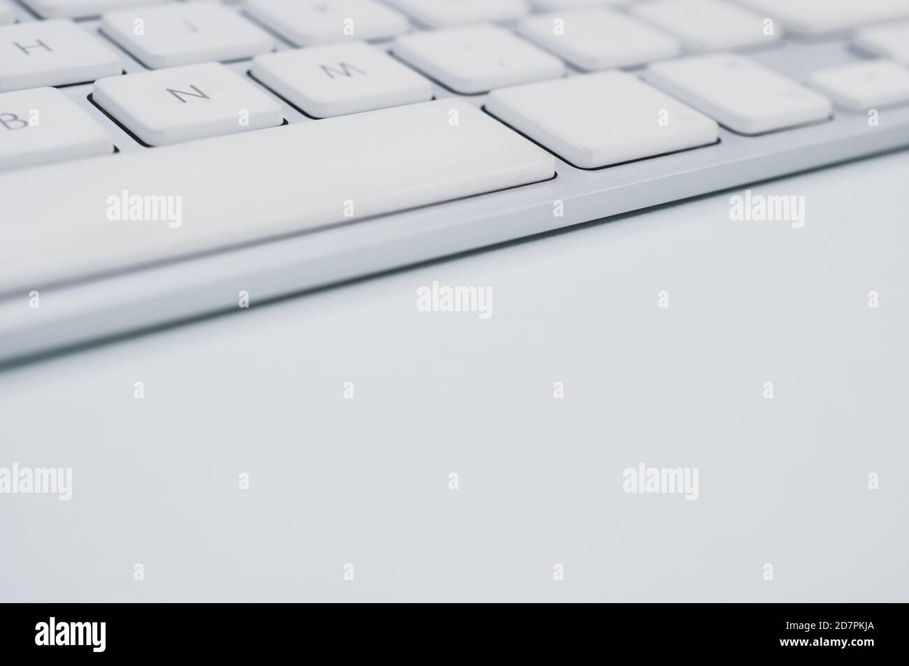 Closeup of a modern and clean keyboard on a surface Stock Photo - Alamy