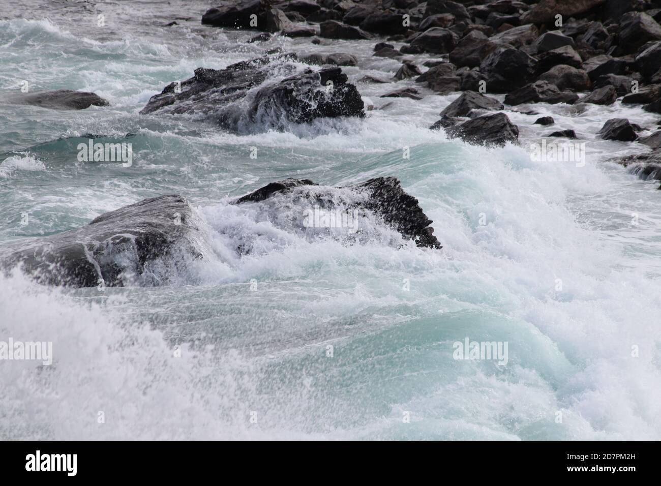Waves breaking on rocks Stock Photo - Alamy