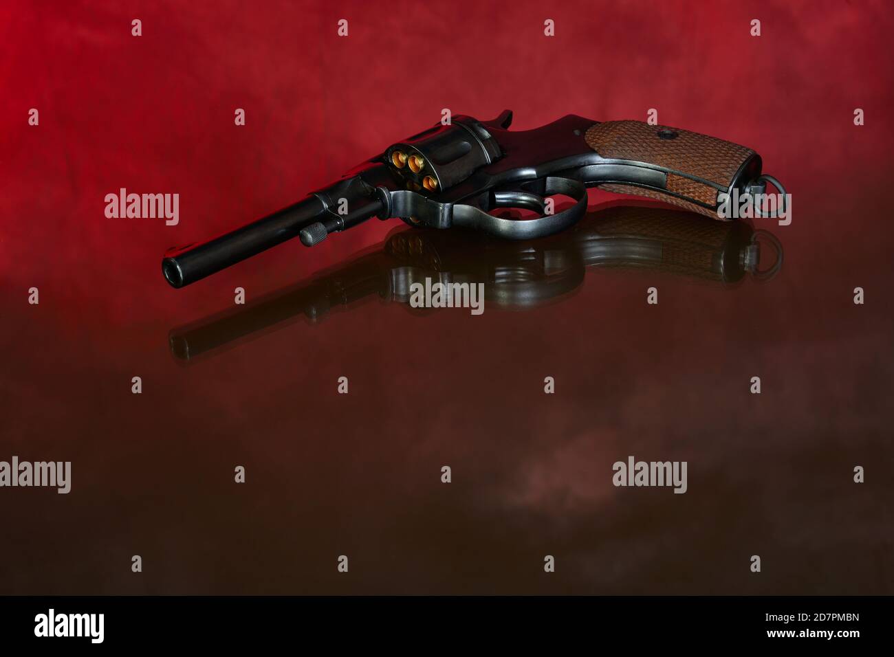Revolver on red background. Vintage pistol revolver Stock Photo - Alamy