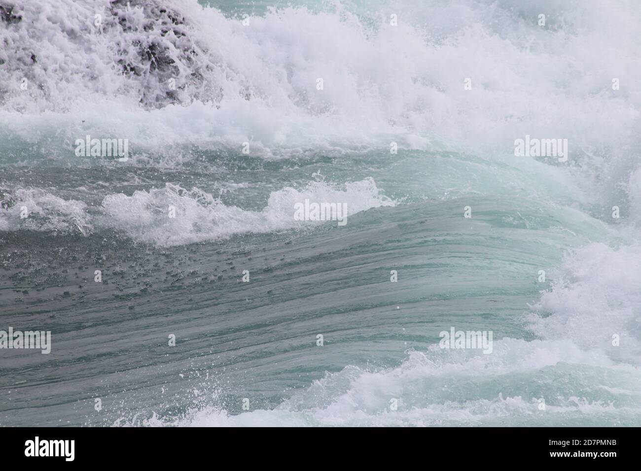 Waves breaking on rocks Stock Photo - Alamy