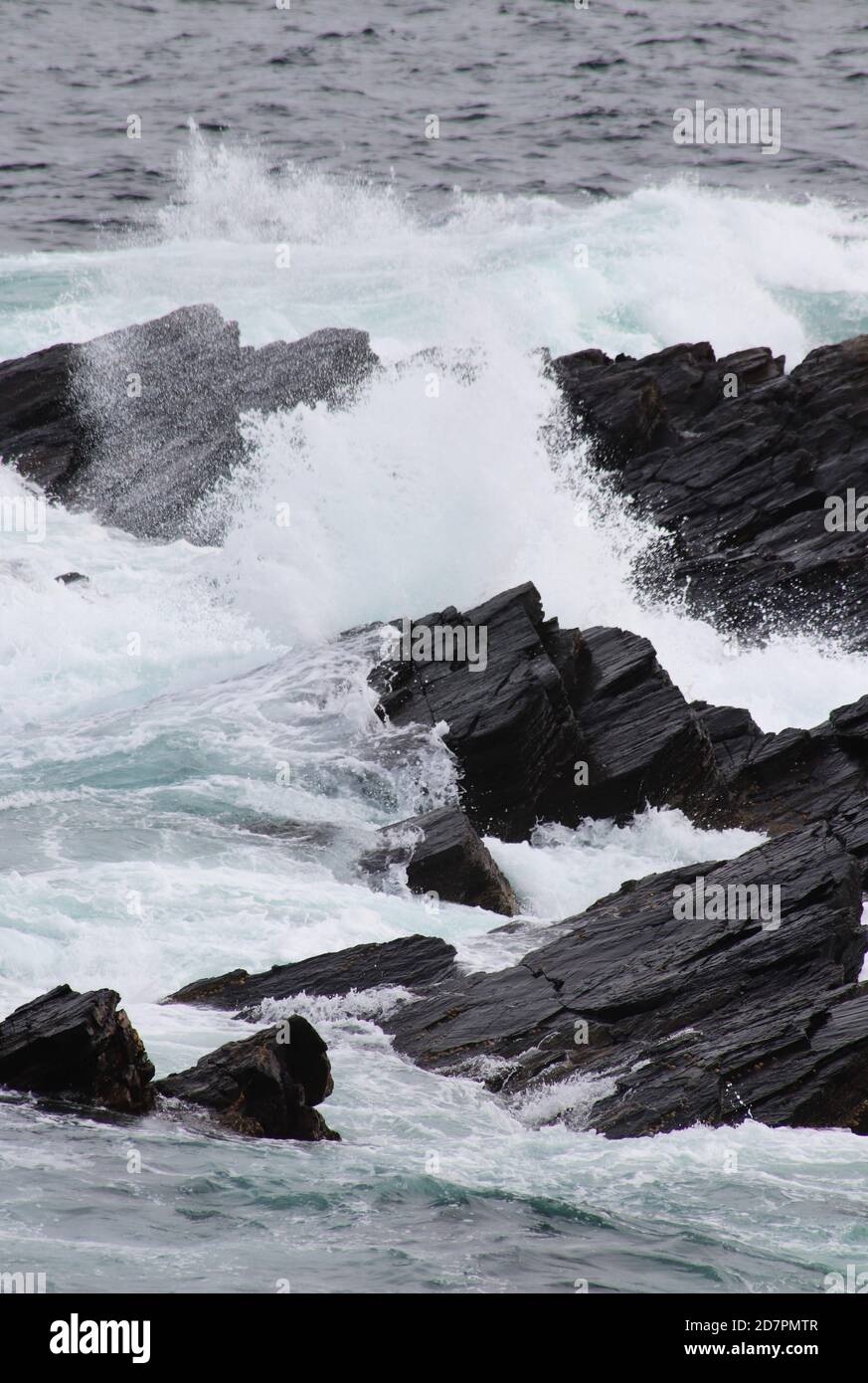 Waves breaking on rocks Stock Photo - Alamy