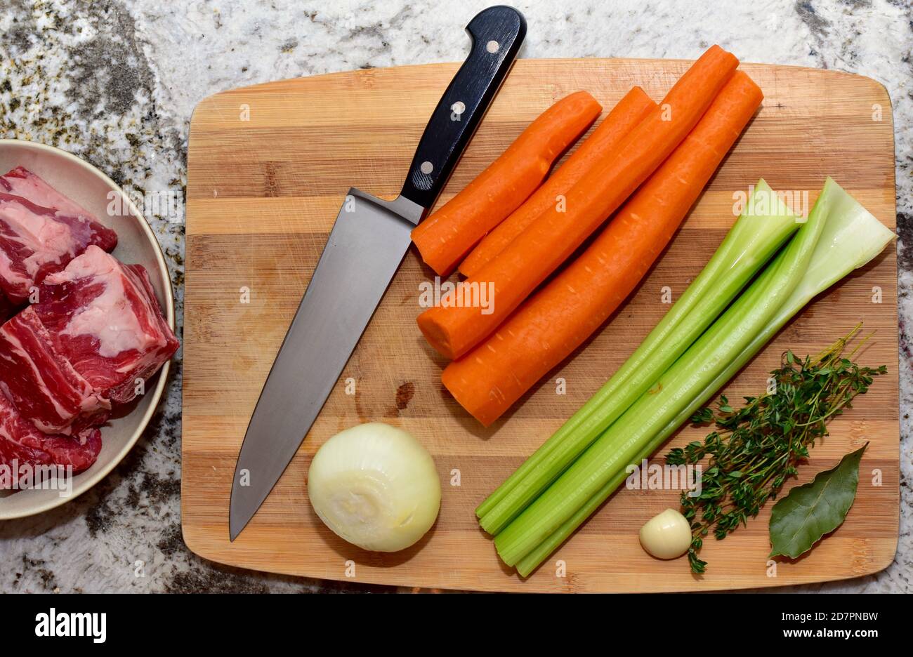 Fresh whole food ingredients ready for preparing braised simmering beef ...