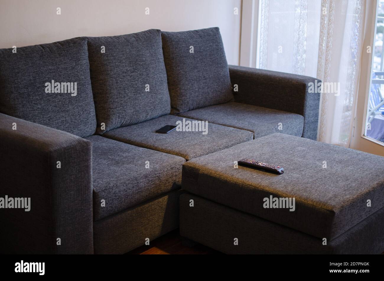 Modern sofa bed by the window Stock Photo - Alamy