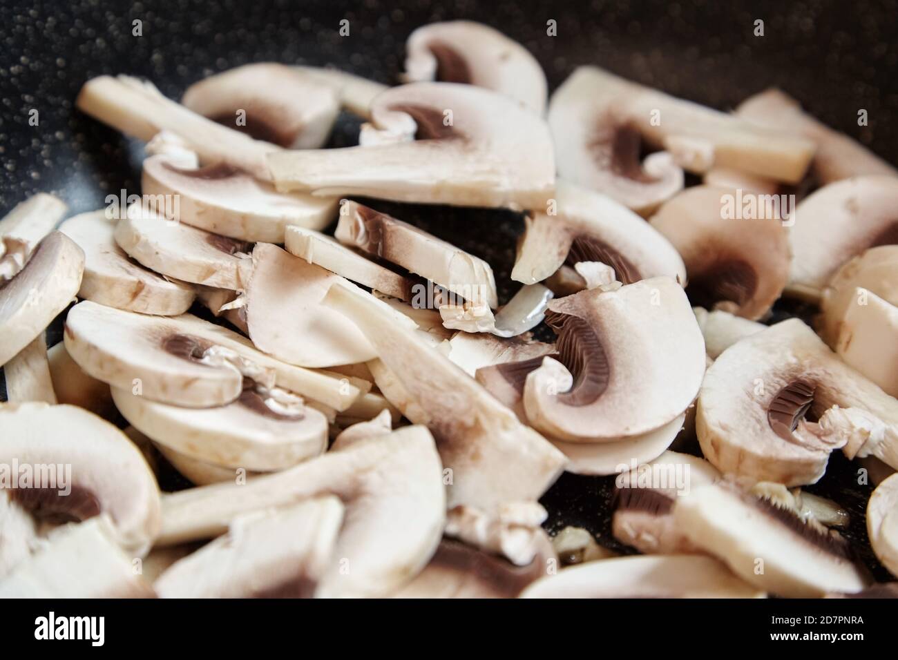 Sliced white champignon mushrooms for vegan cooking, food background ...