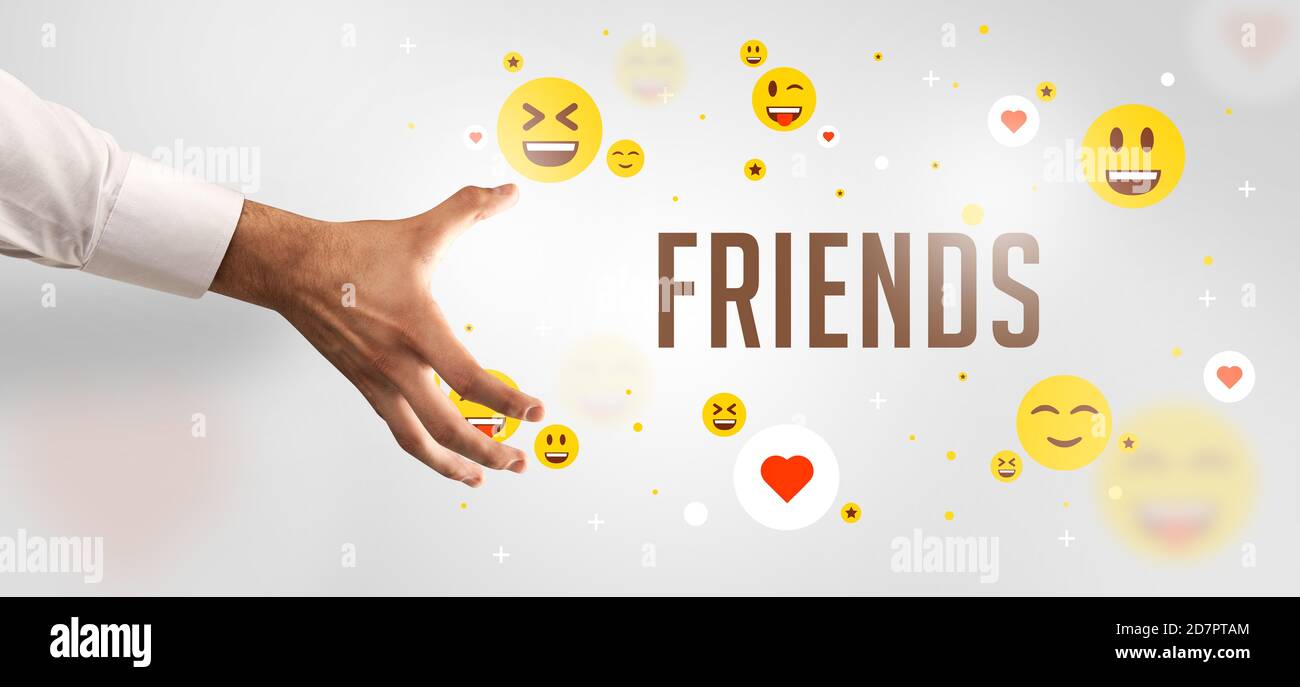 Close-Up of cropped hand pointing at FRIENDS inscription, social media ...