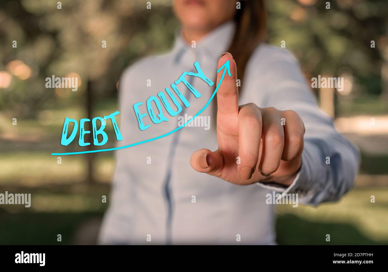 Writing note showing Debt Equity. Business concept for dividing ...