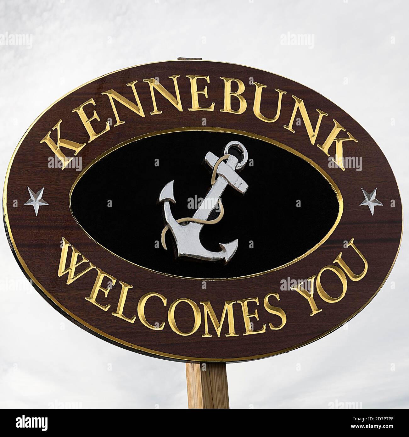 Welcome sign with pictogram Anchor at the entrance to the town ...