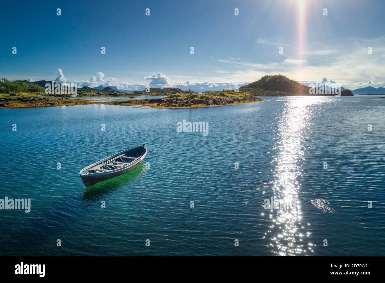 Small wooden boat between skerries in the sea, Lodingen, Nordland ...