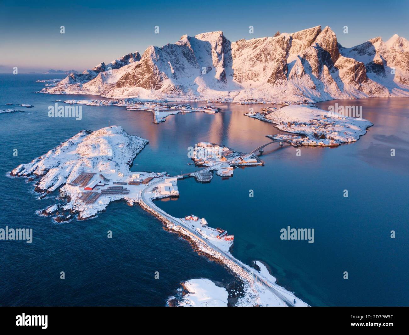 Aerial view, fjord landscape at sunrise, snowy mountains in winter ...