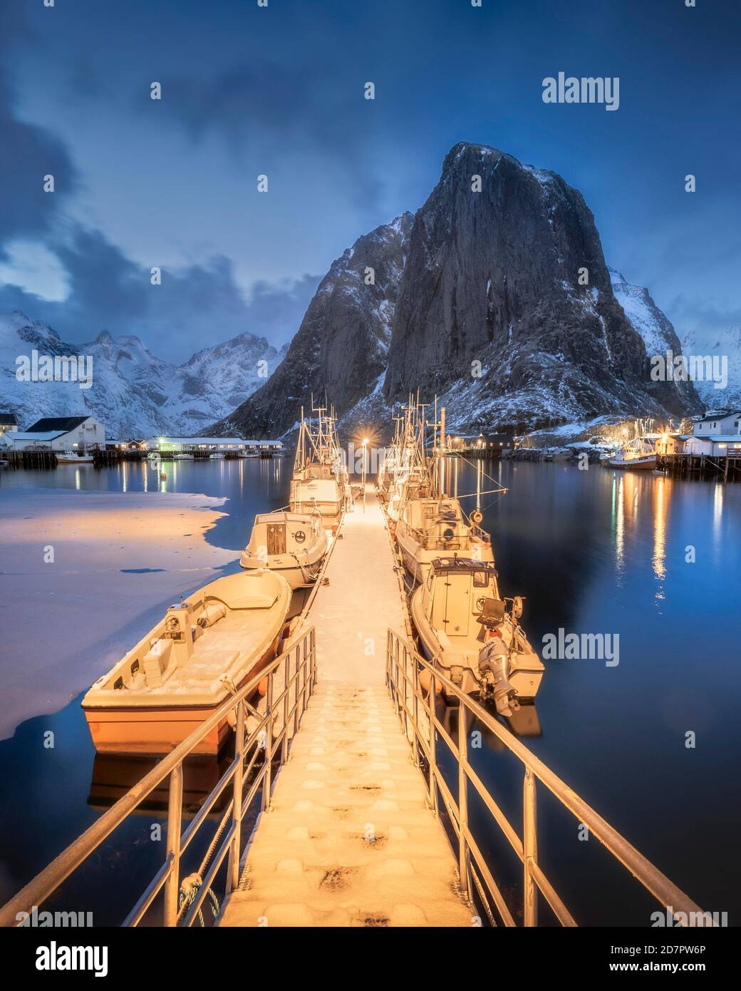 Illuminated landing stage, jetty at the harbour of the fishing village ...