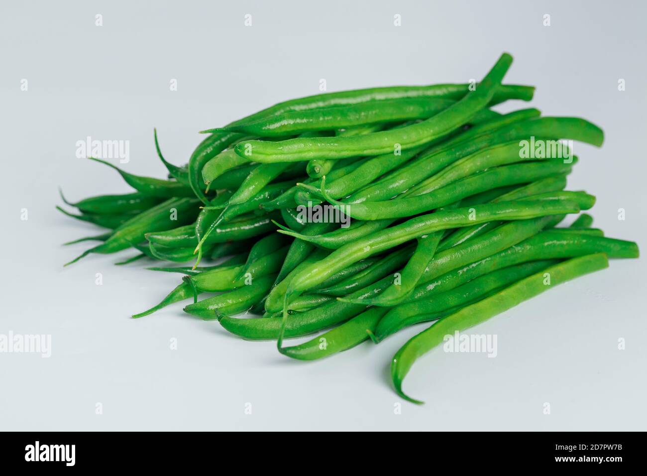Green long beans isolated on a white background Stock Photo - Alamy