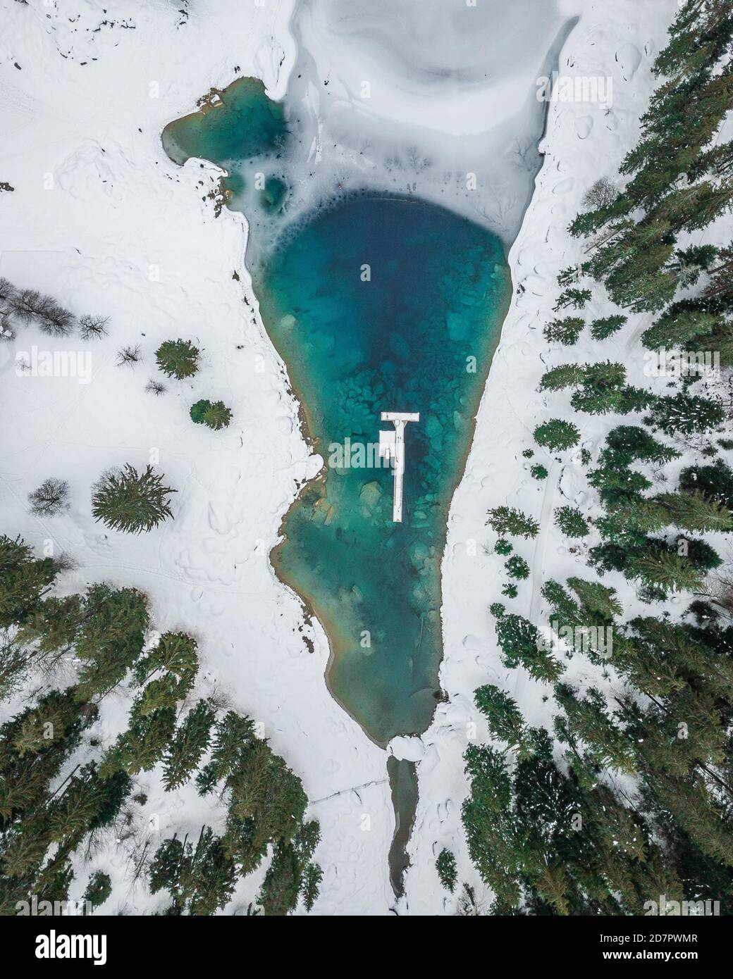 Aerial view, partly frozen Lake Cauma in winter, Grisons, Switzerland ...