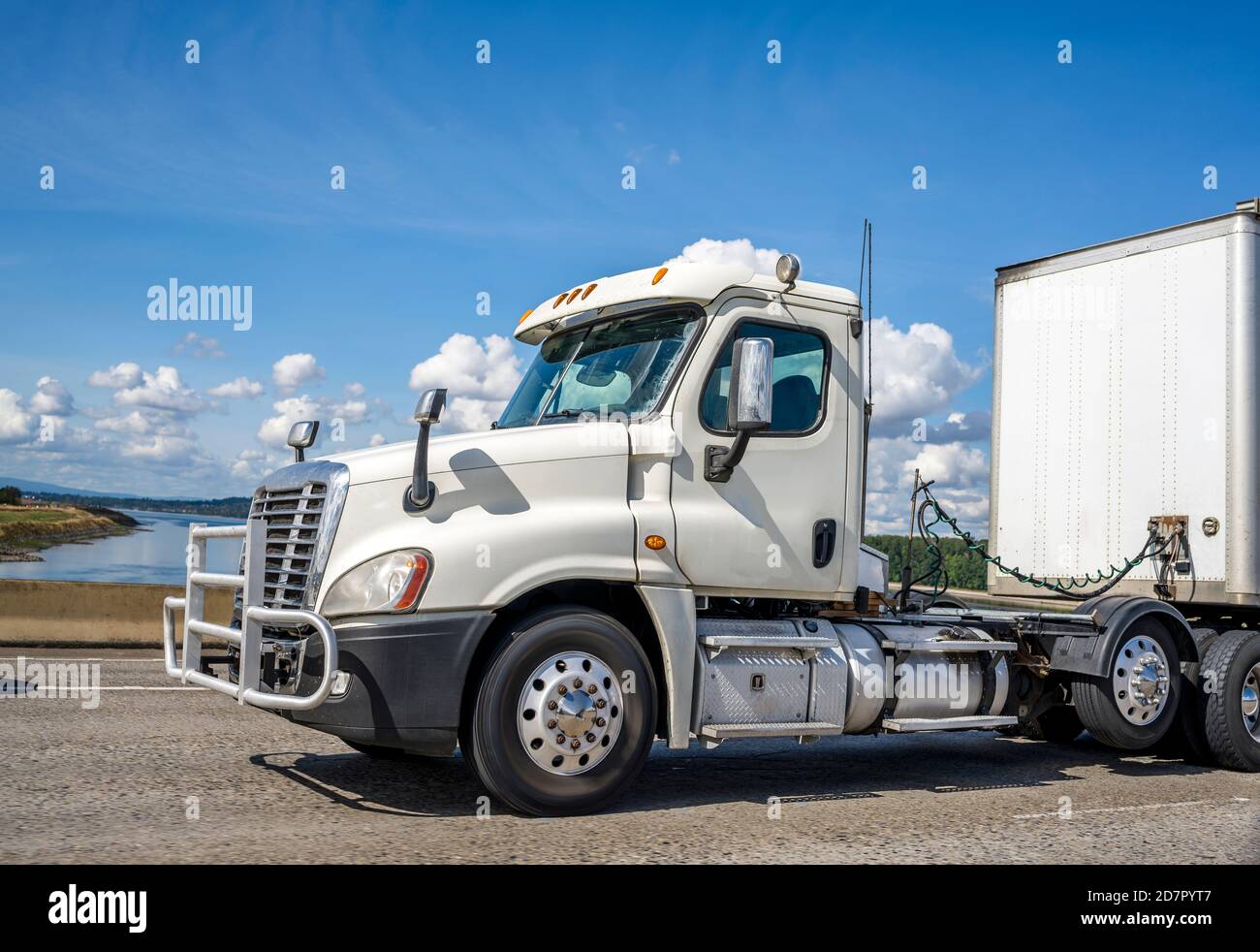 Powerful big rig white industrial grade day cab diesel semi truck with ...
