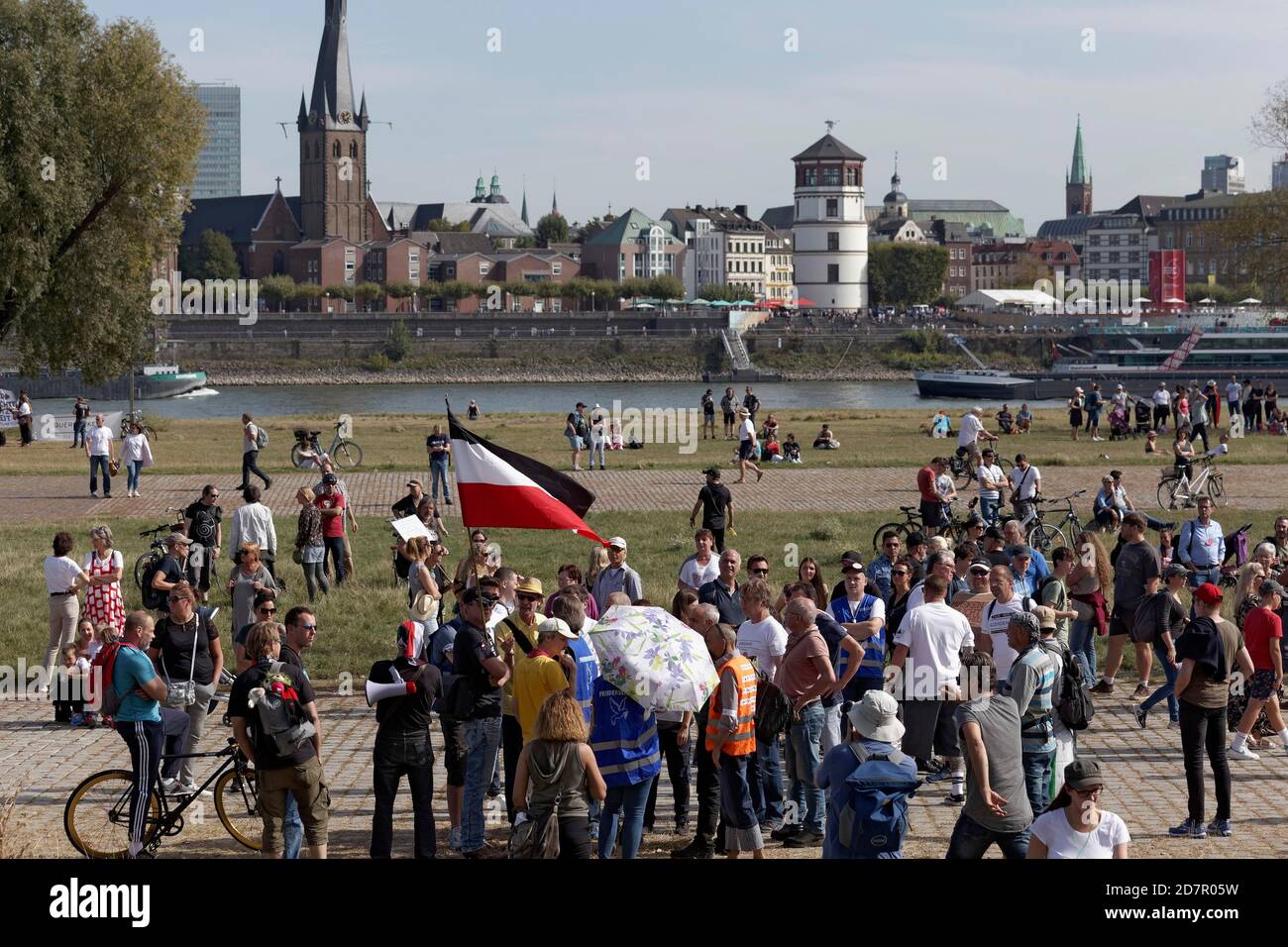 Demo against Corona rules on the Rhine meadows, man with forbidden ...
