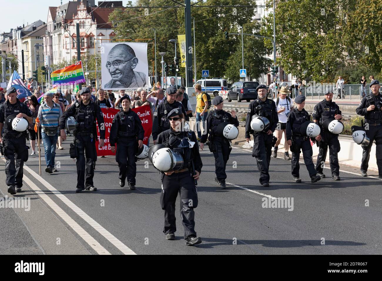 Police marches in front of demonstration march with portrait of Mahatma ...