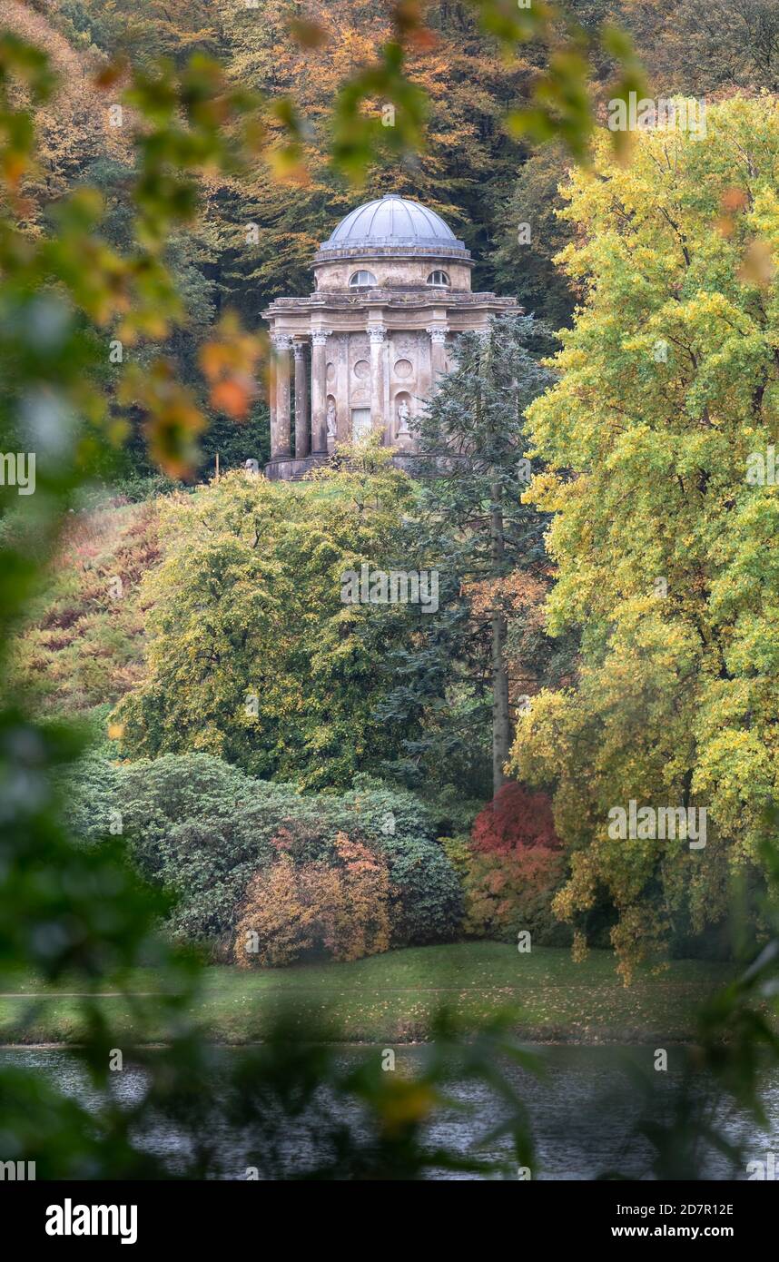 Temple of Apollo located amidst trees and shrubs overlooking the lake ...