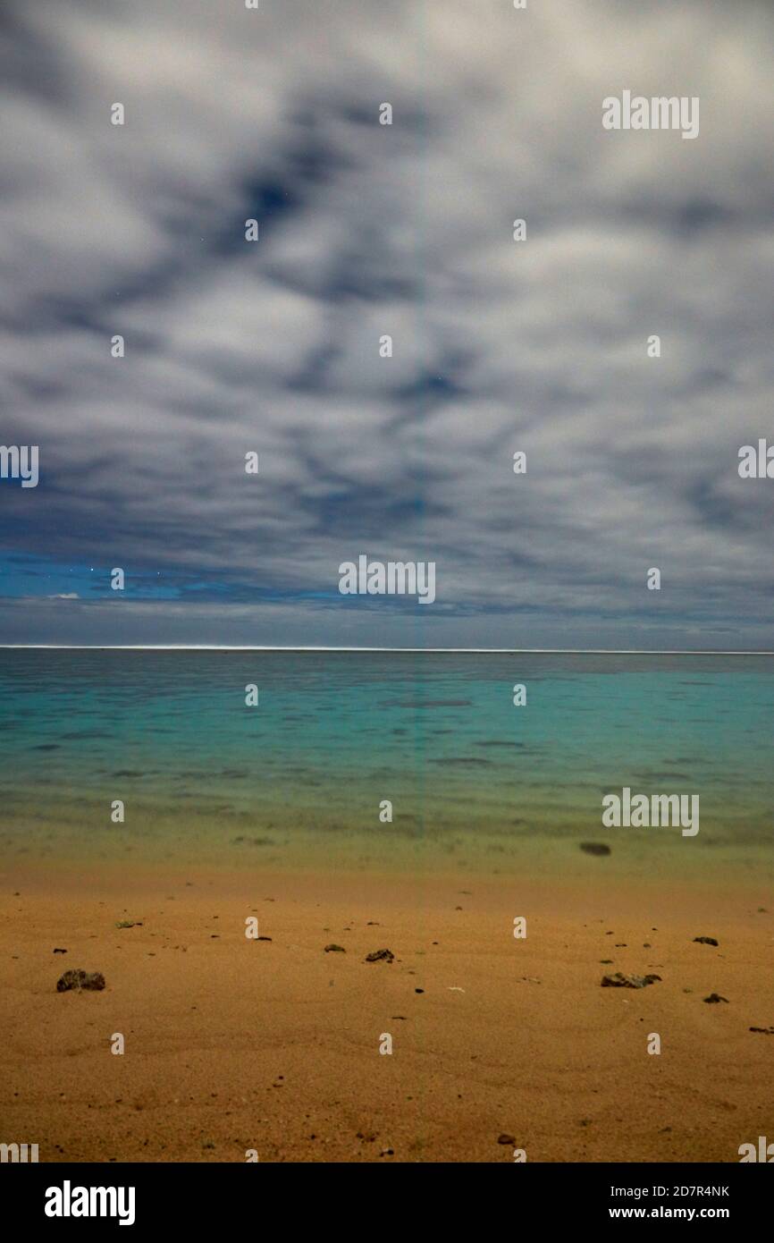 Moonlight lighting Aroa Beach late at night, Rarotonga, Cook Islands ...