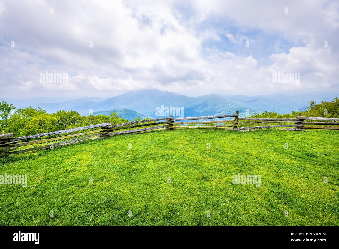 Devil's Knob Overlook with wooden fence and green grass field meadow at ...