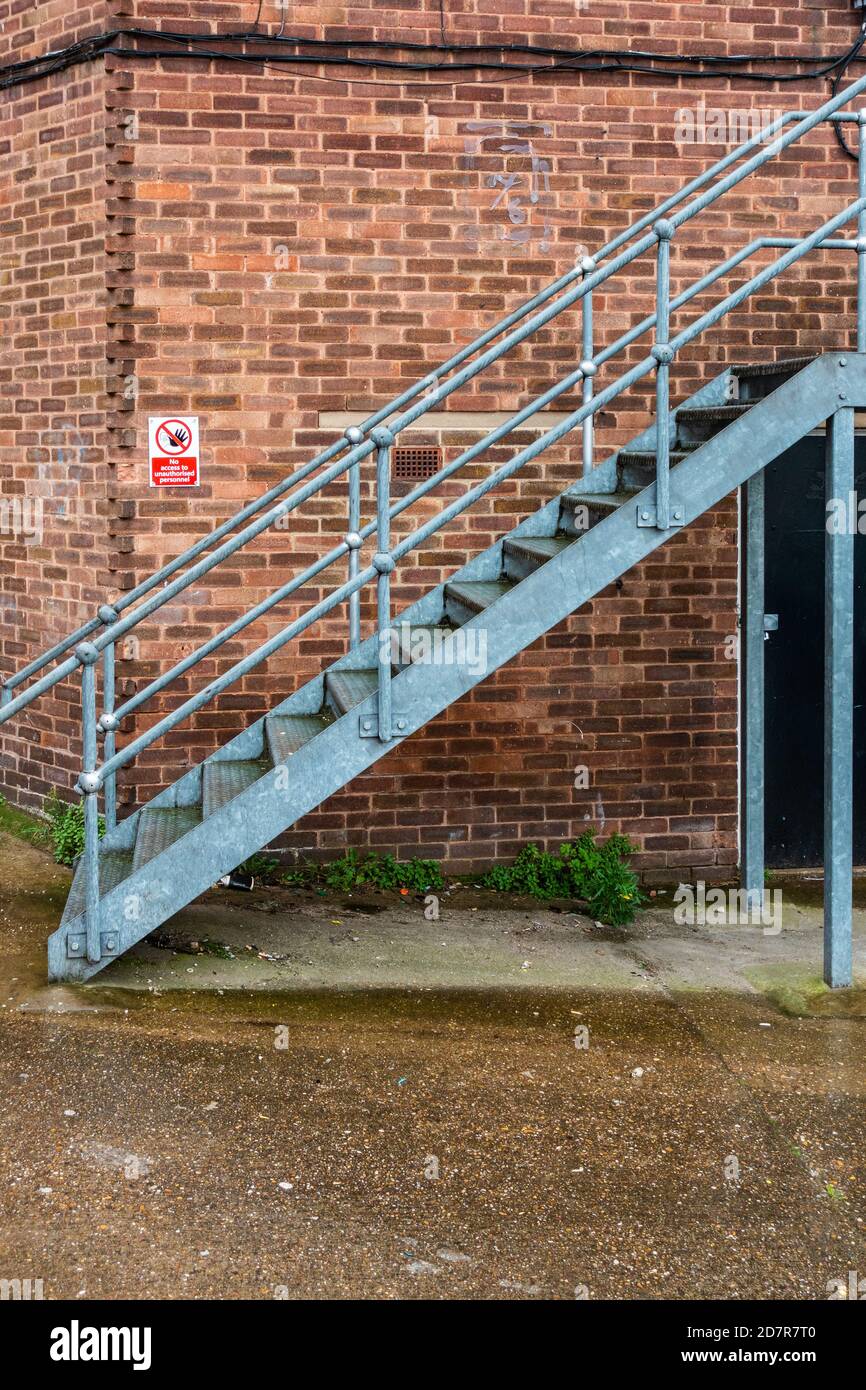 Metal fire escape stairs leading down Stock Photo - Alamy