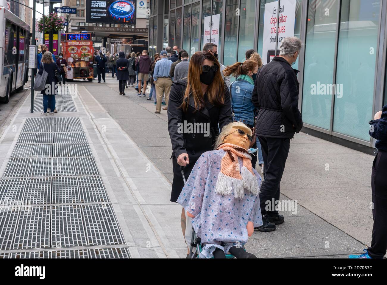 NEW YORK, NY - OCTOBER 24, 2020: People seen standing in lines to cast ...