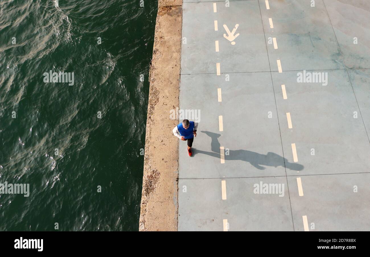 Man running looking from above hi-res stock photography and images - Alamy