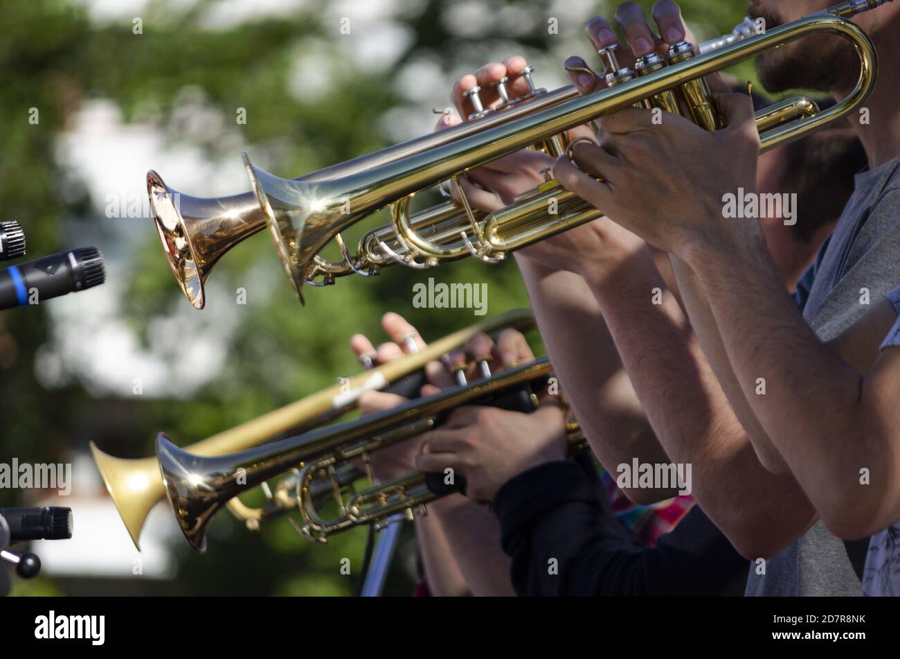 Trumpets holding hi-res stock photography and images - Alamy